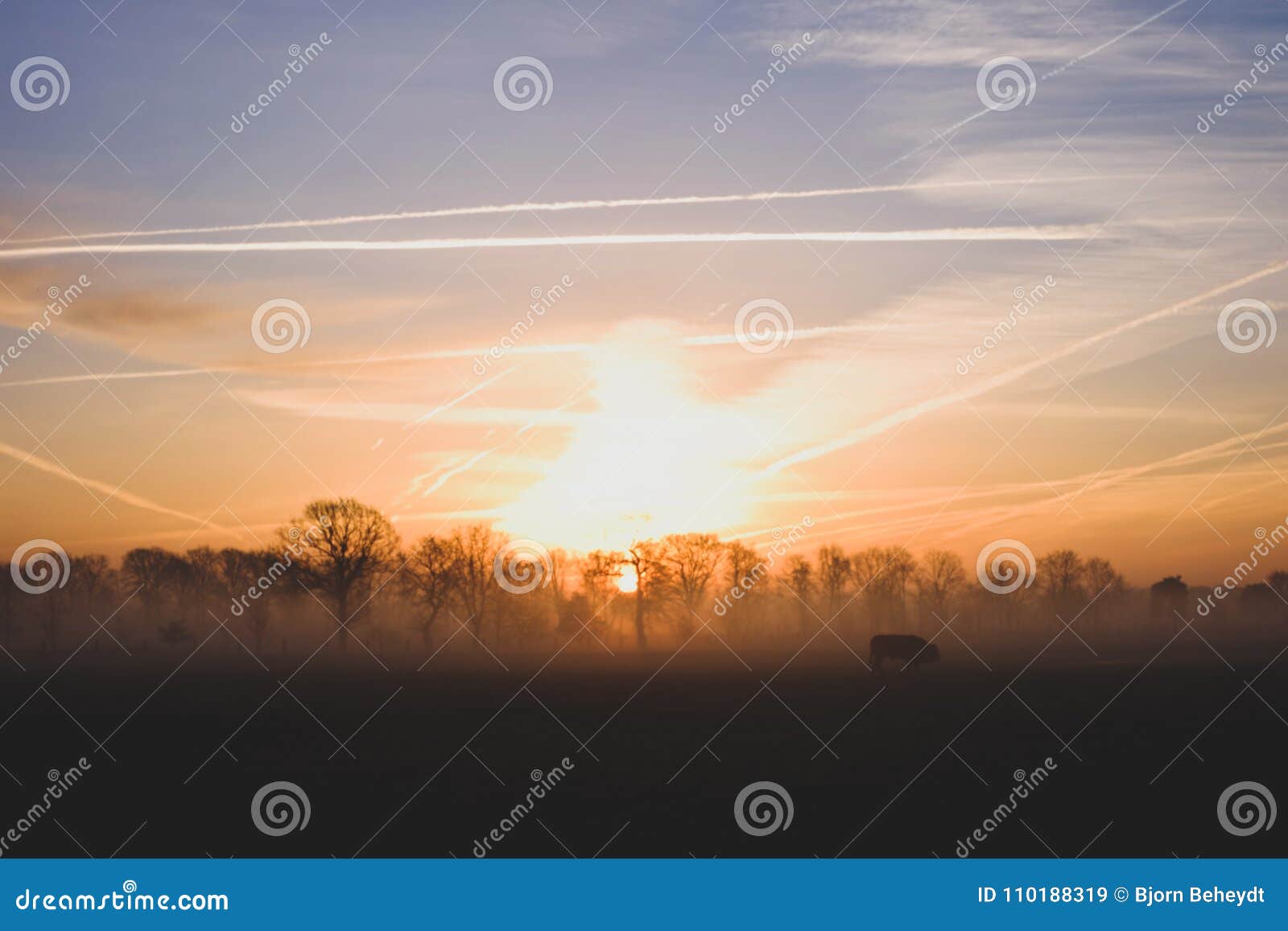 Colorful Hazy Sunset in the Fields with Cloudy Sky Stock Image - Image ...
