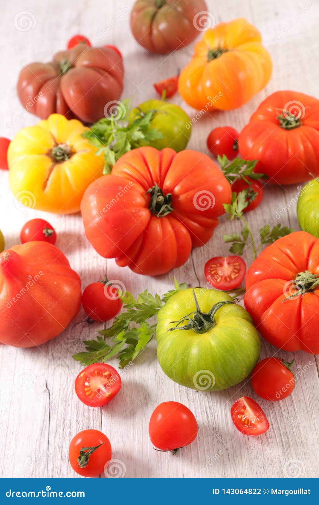 Colorful heap of tomatoes stock photo. Image of studio - 143064822