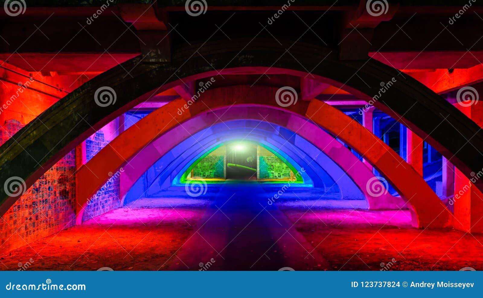 Colorful Illuminated Pathway Under Bridge Stock Photo - Image of ...
