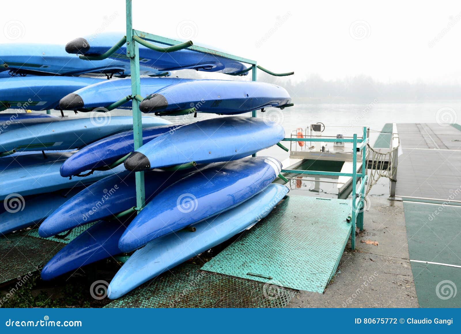 Colorful Kayaks and Canoes in a Row Stack Stock Photo - Image of canoe ...