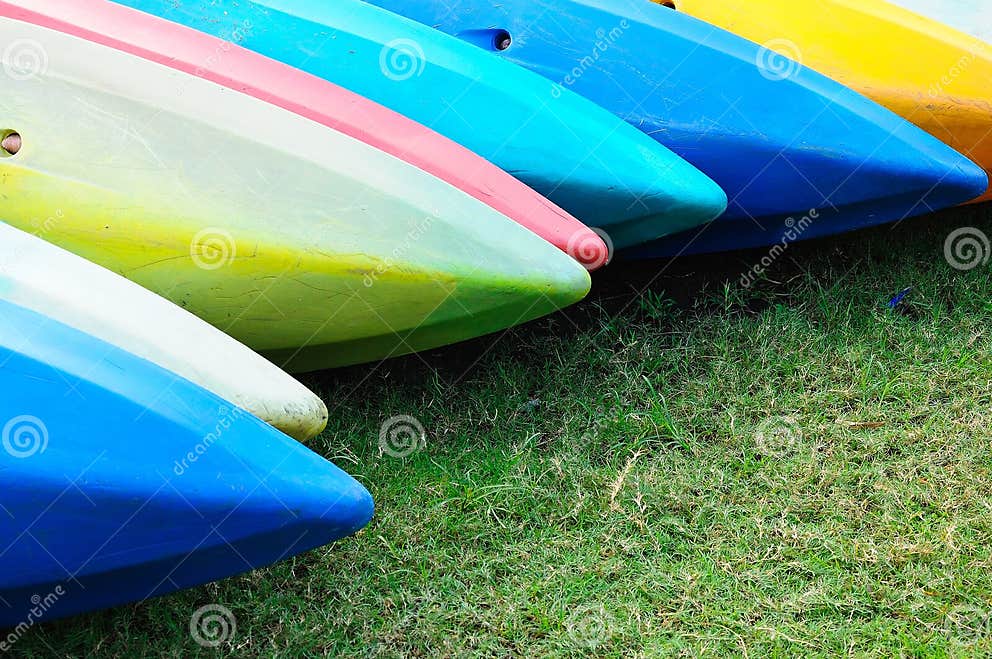 Colorful kayaks in stack stock photo. Image of exercise - 29946542