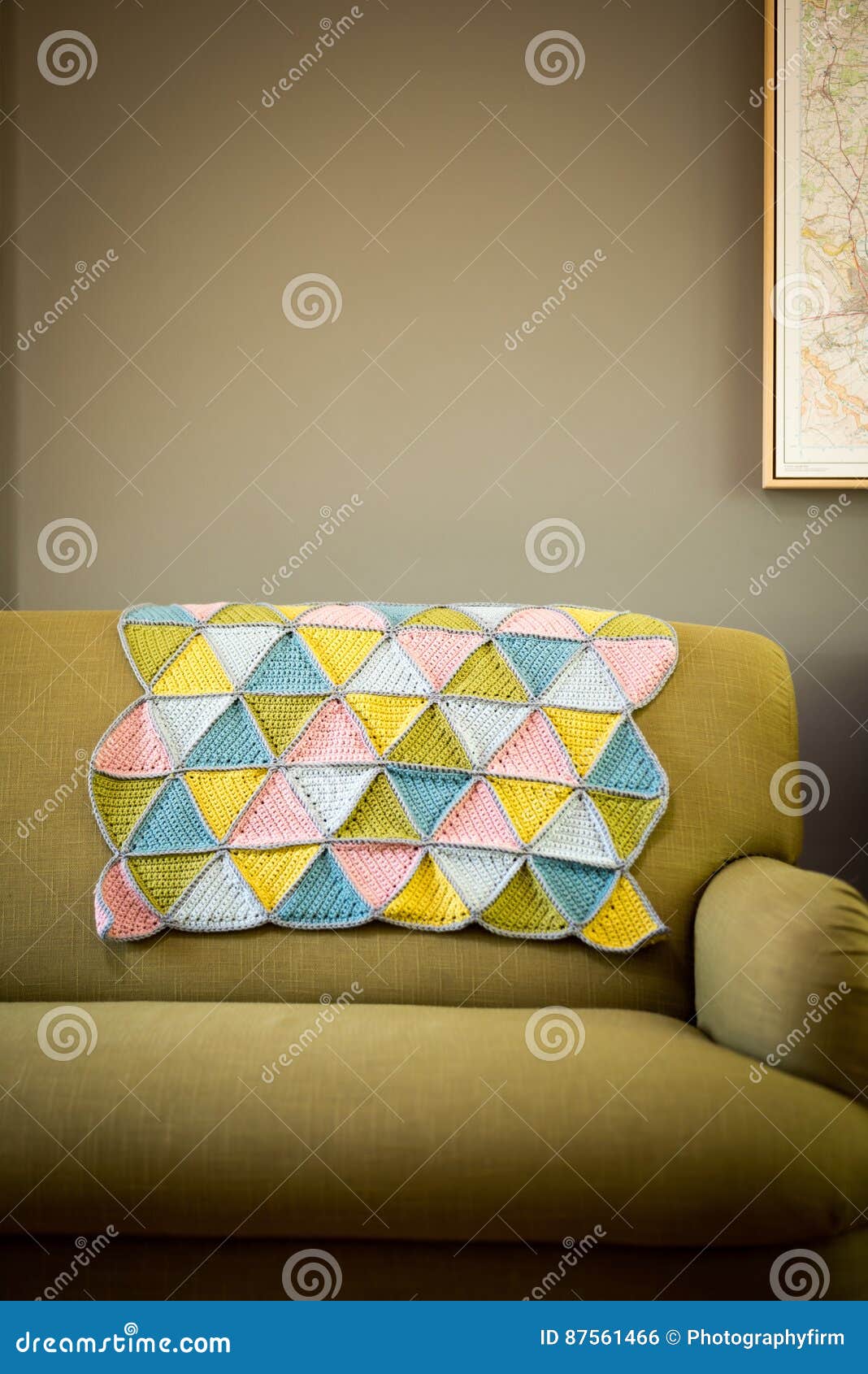 Colorful Knitted Triangle Pattern Decorative Mat on Couch Stock Photo ...