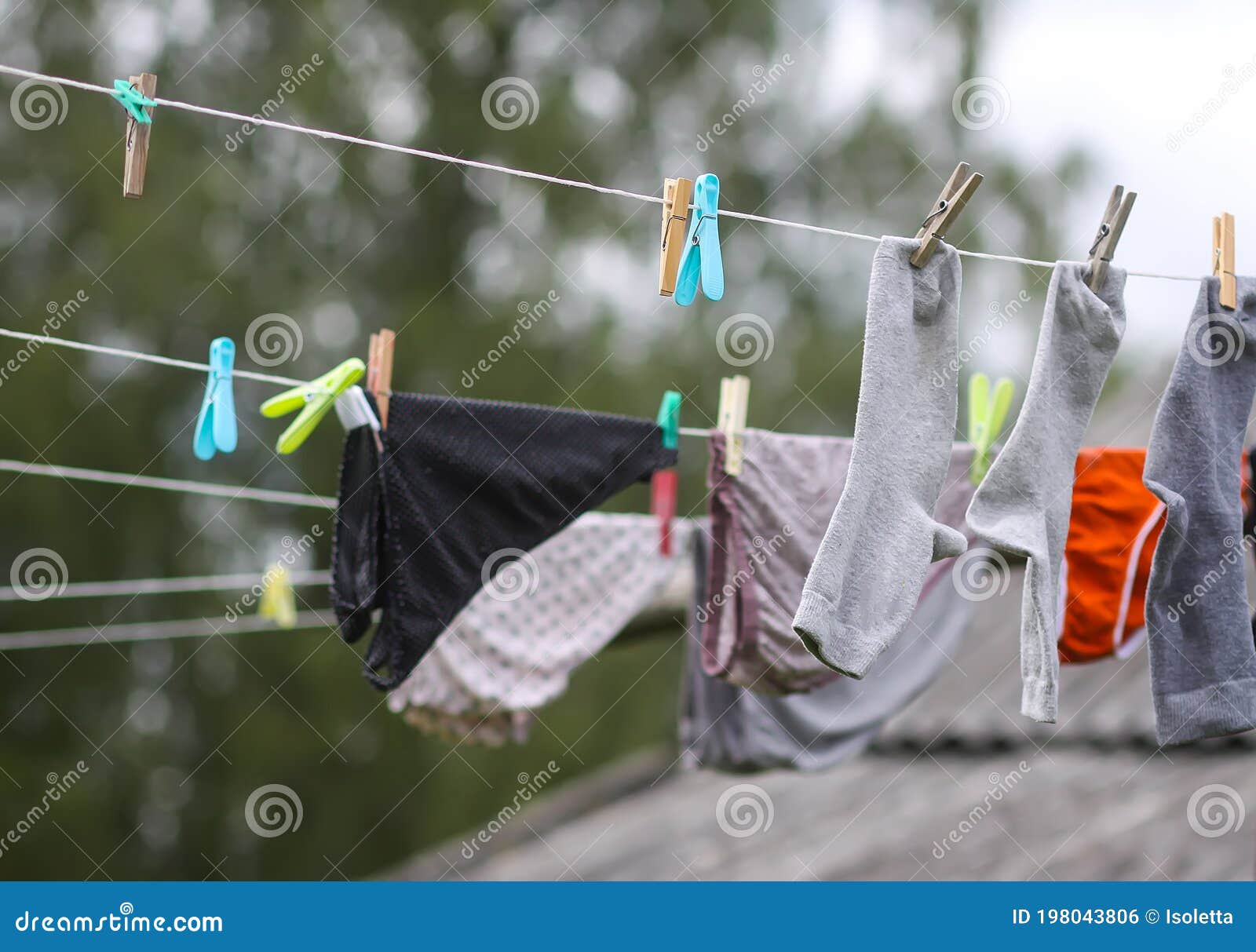 Colorful Laundry Hanging on the Rope Outdoors Stock Photo - Image of ...