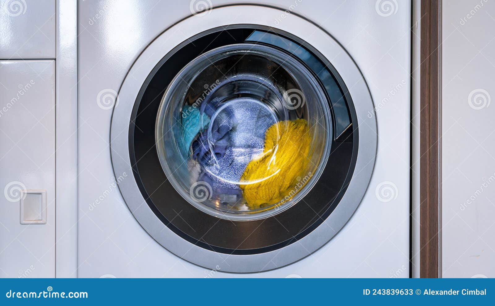 Colorful Laundry Inside a Front Loader Washing Machine Stock Image ...