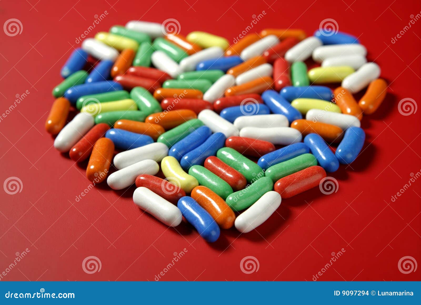 Colorful Little Candy Sweets Over Red Stock Photo - Image of heart ...