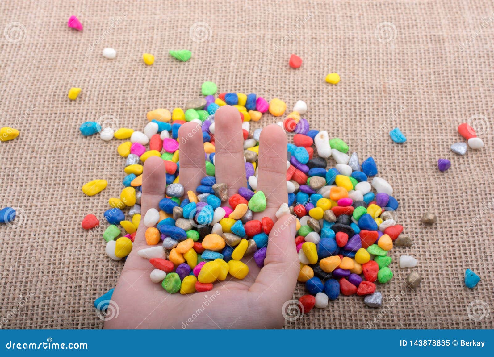Colorful Little Pebbles in Hand and on Ground Stock Image - Image of ...