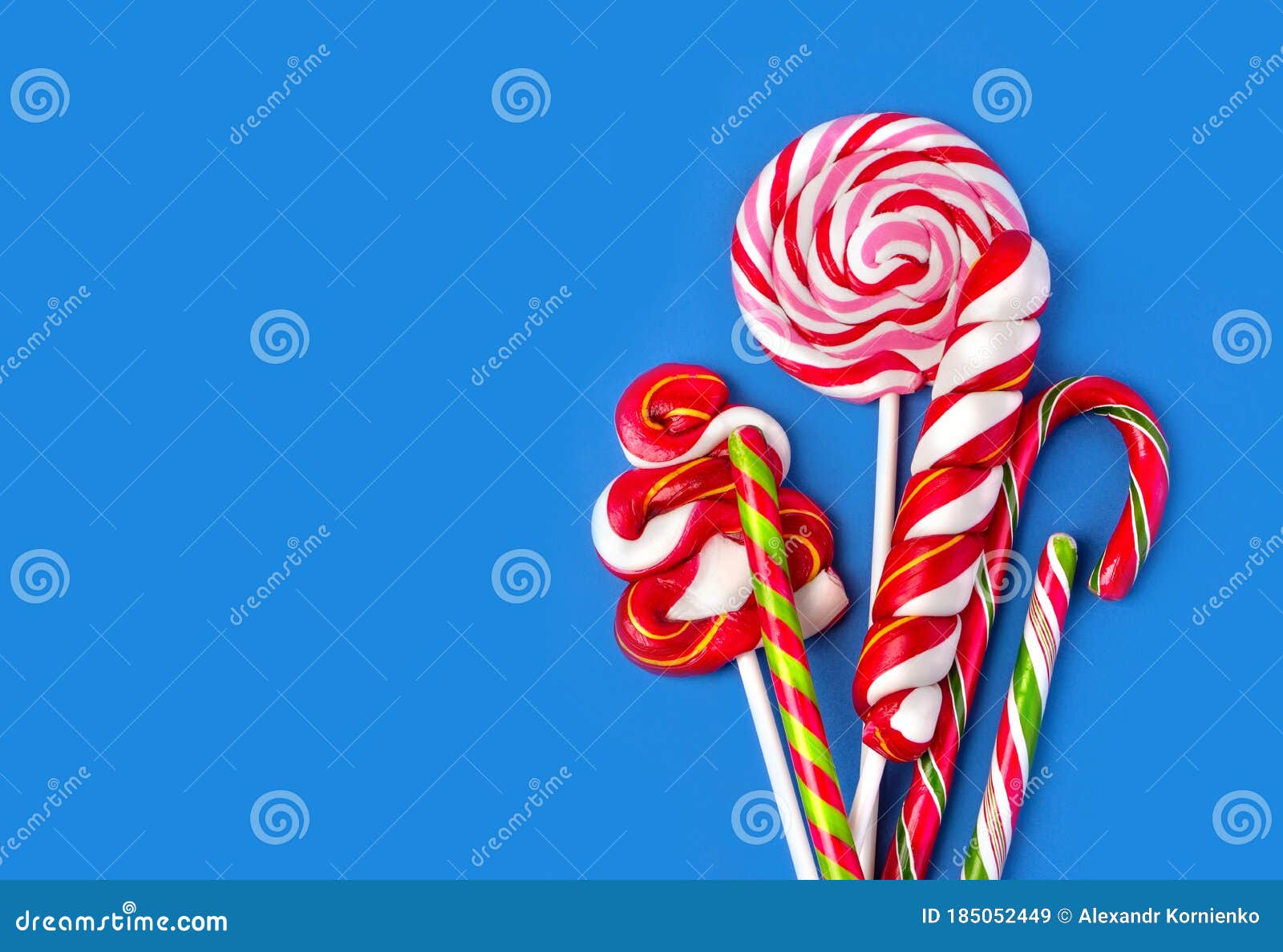 Colorful lollipop on blue stock image. Image of childhood - 185052449