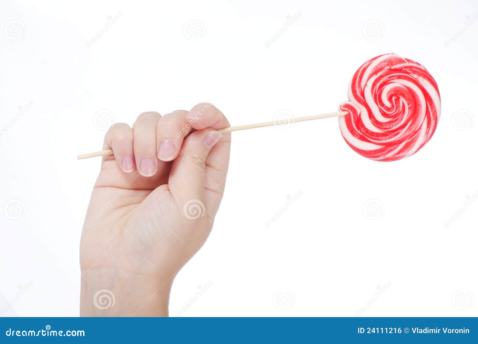 Colorful lollipop in hand stock photo. Image of lollypop - 24111216