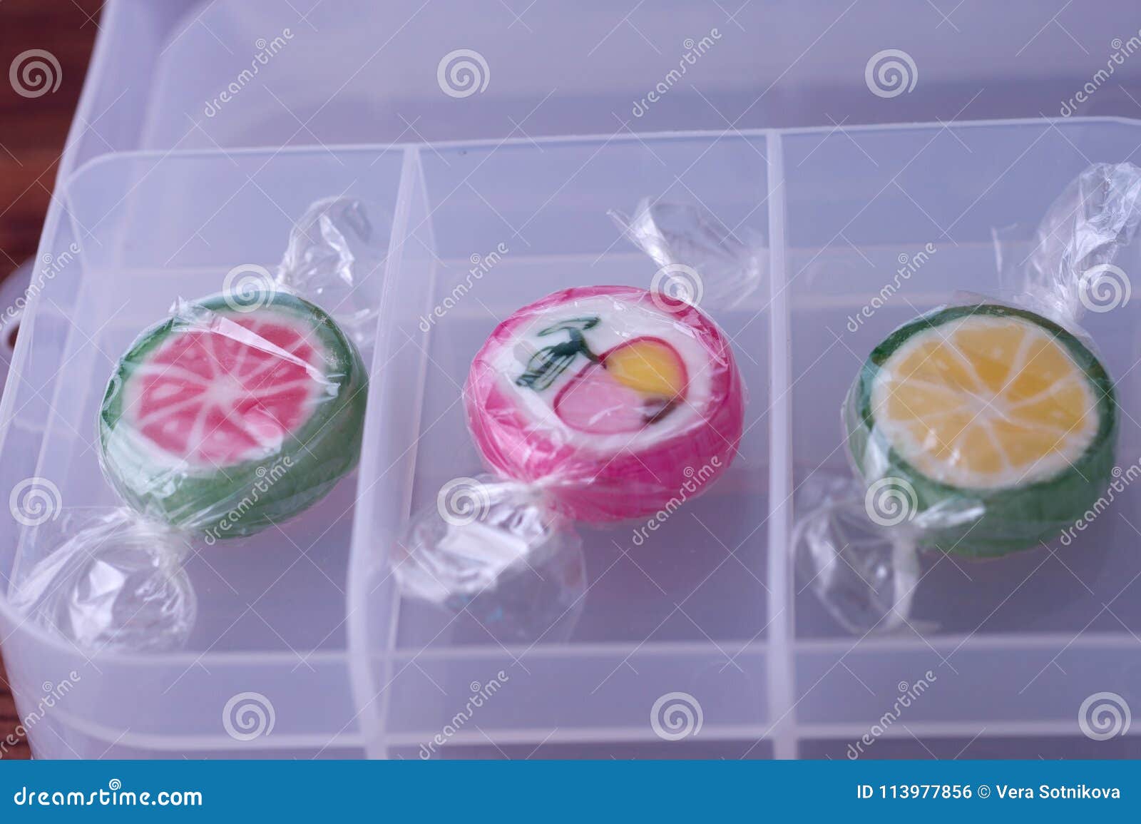 Colorful Lollipops and Different Colored Fruit Round Candy in Wrapper ...