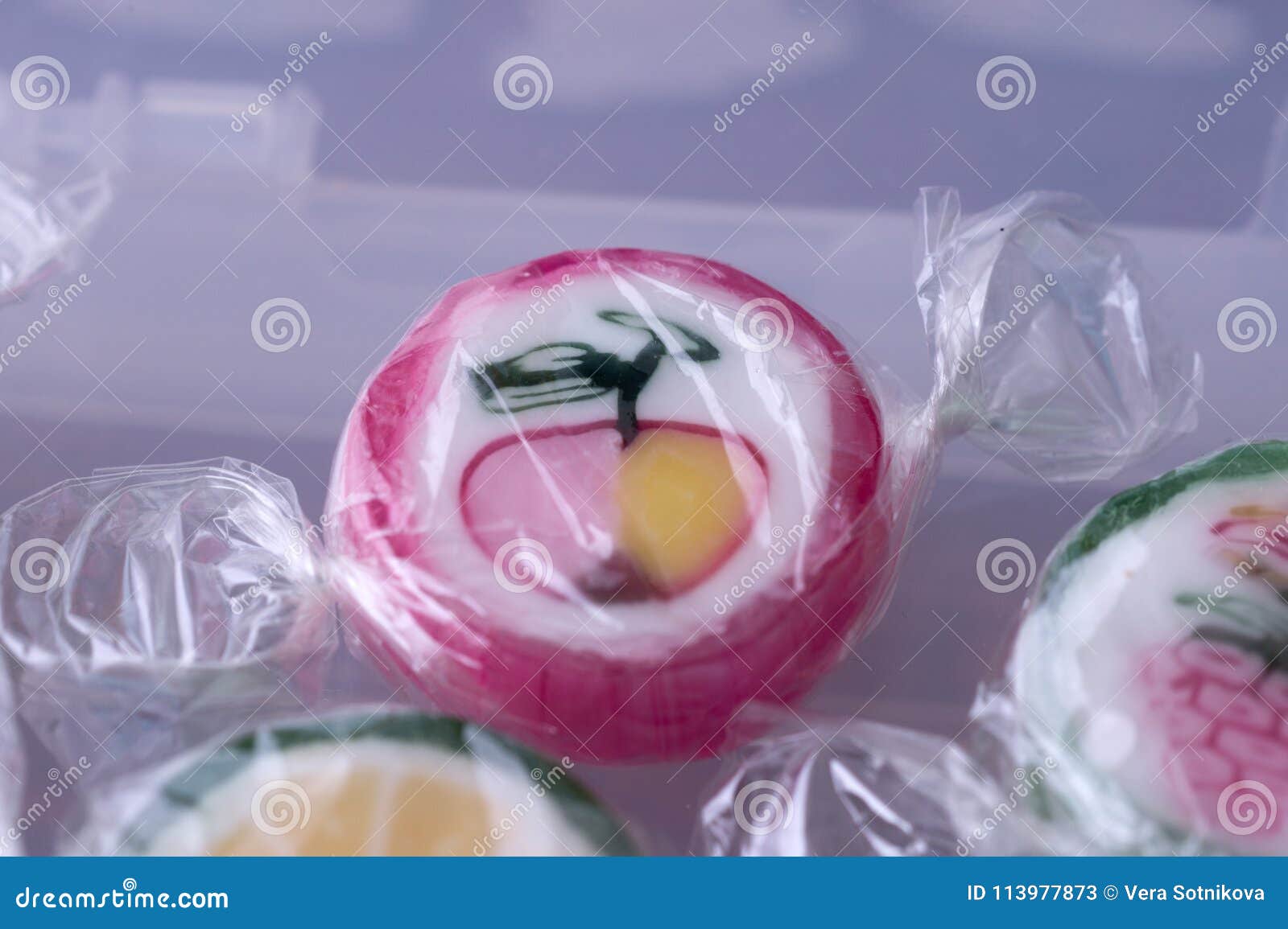 Colorful Lollipops and Different Colored Fruit Round Candy in Wrapper ...