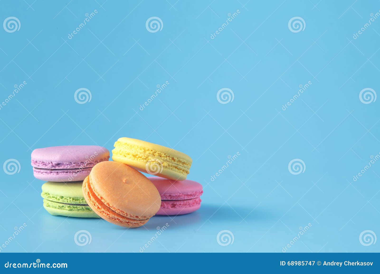 Colorful macaron on blue stock image. Image of background - 68985747