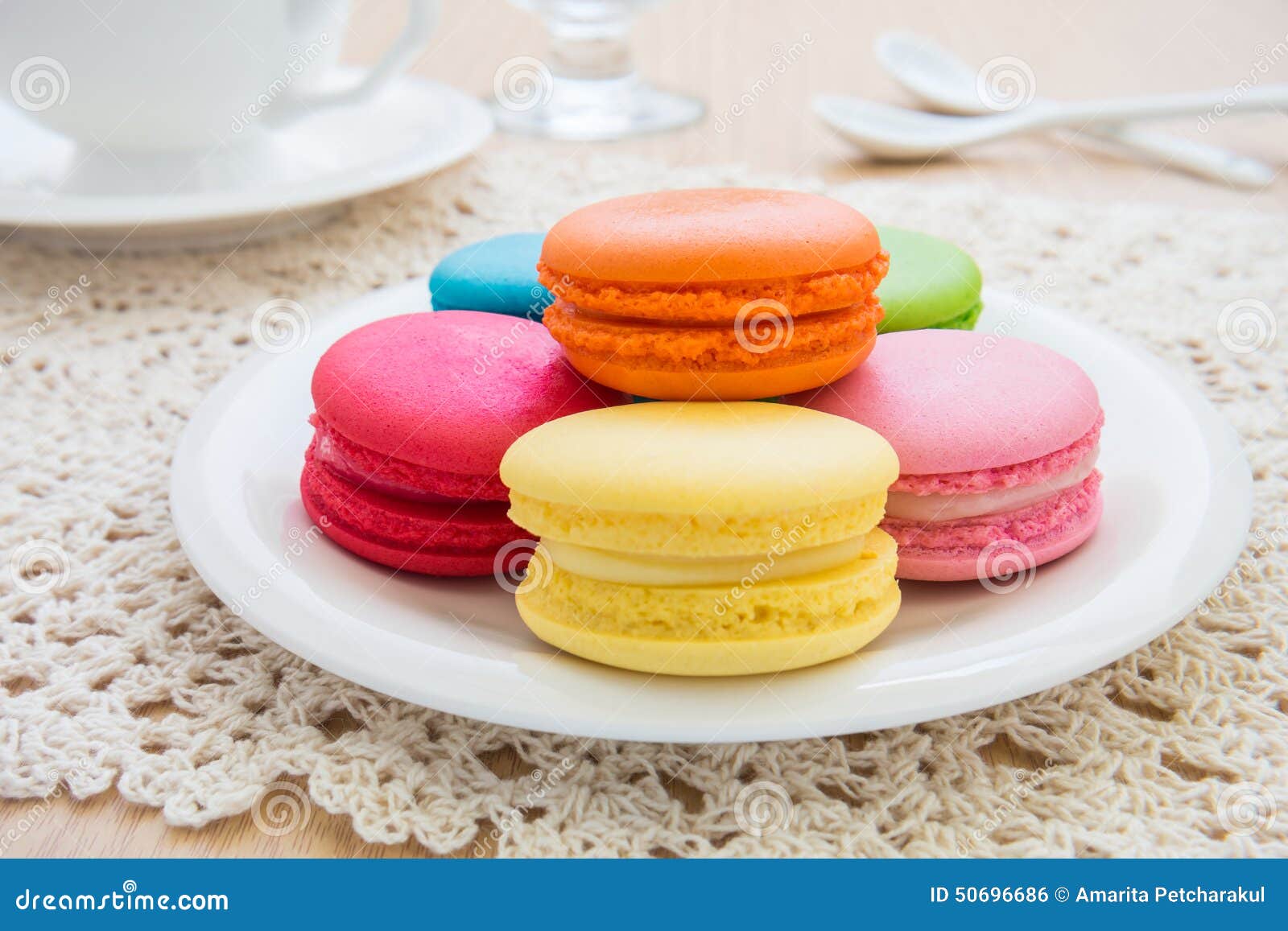 Colorful macarons on plate stock photo. Image of cake - 50696686