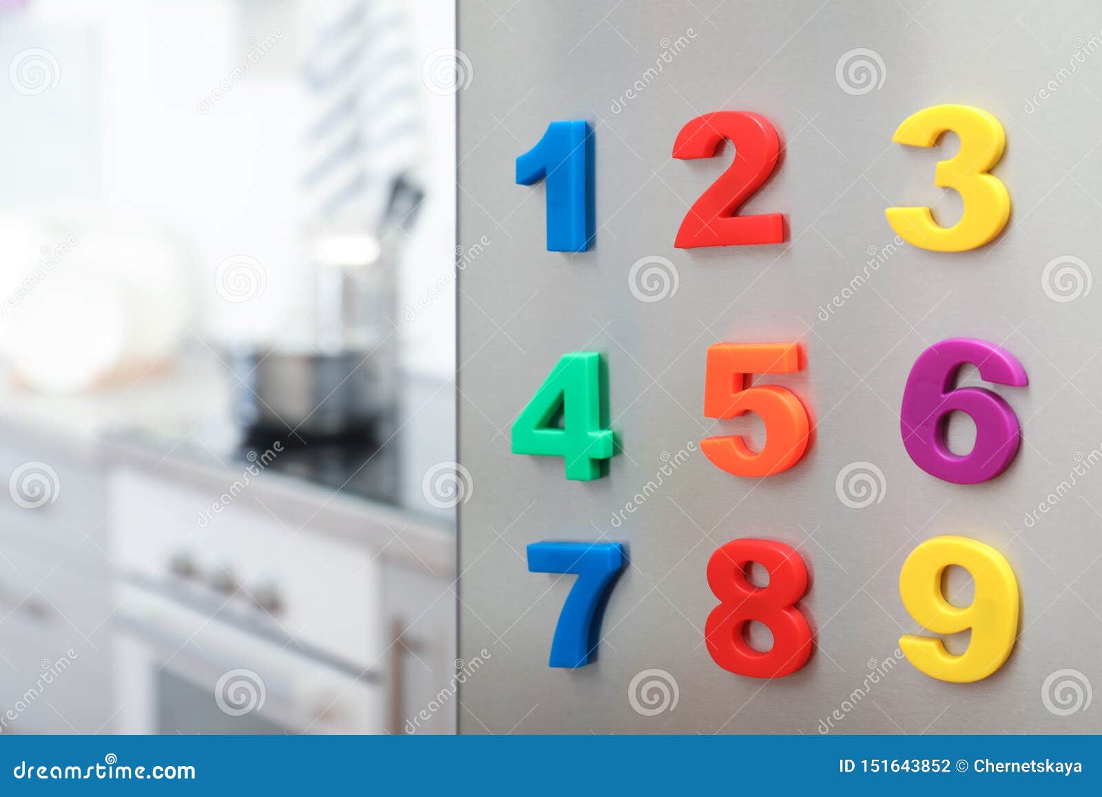 Colorful Magnetic Numbers on Refrigerator Door in Kitchen Stock Photo ...