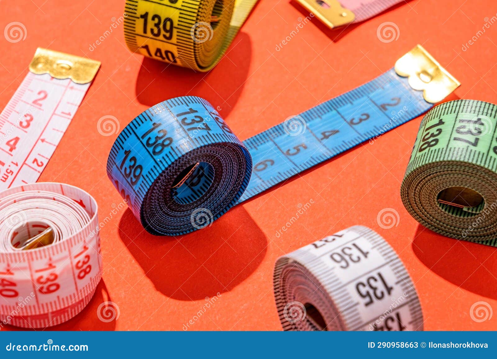 Colorful Measuring Tapes Top View on Bright Red Background Stock Image ...