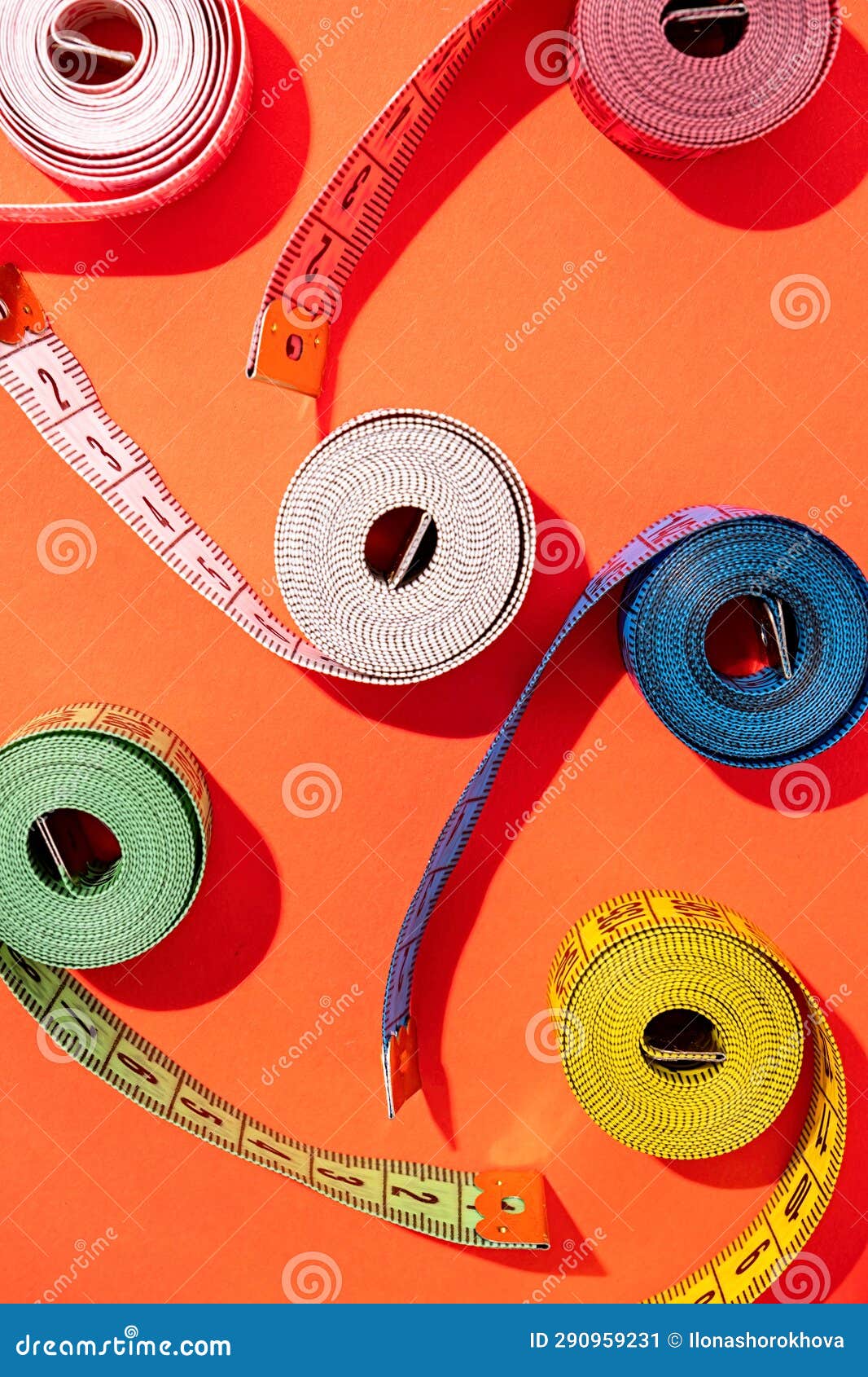 Colorful Measuring Tapes Top View on Bright Red Background Stock Image ...