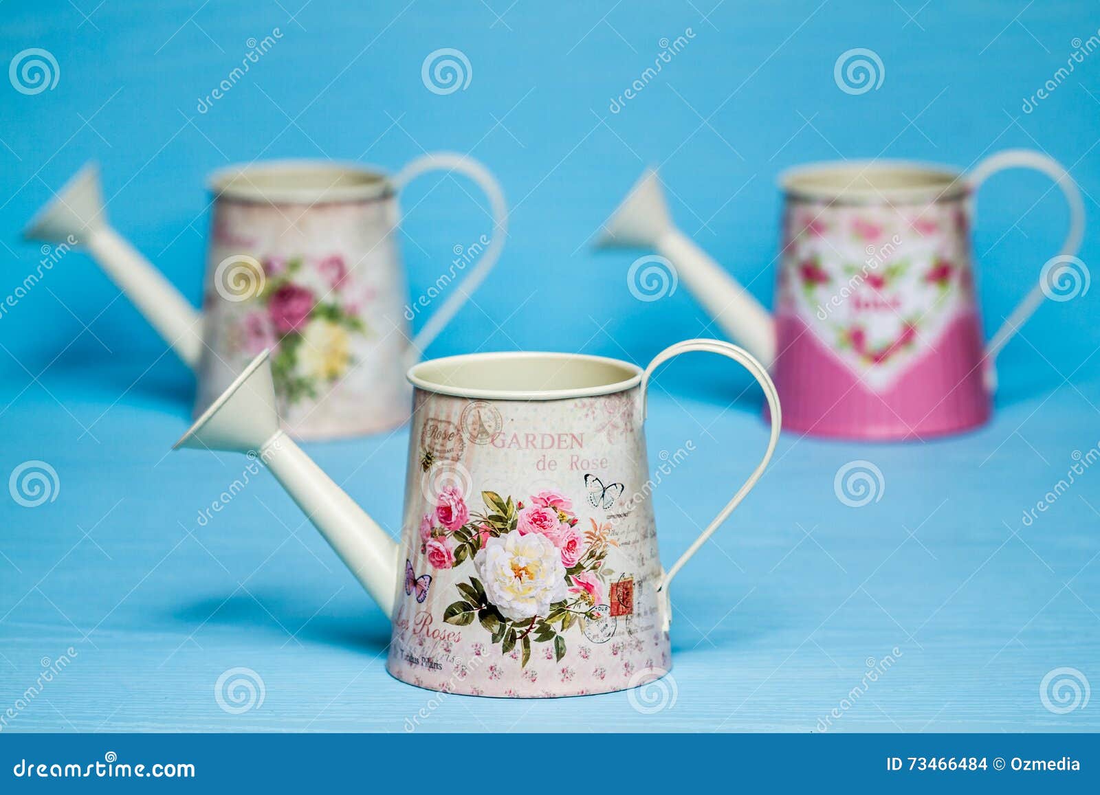 Colorful Metallic Watering Cans with Flower Pattern Stock Photo - Image ...