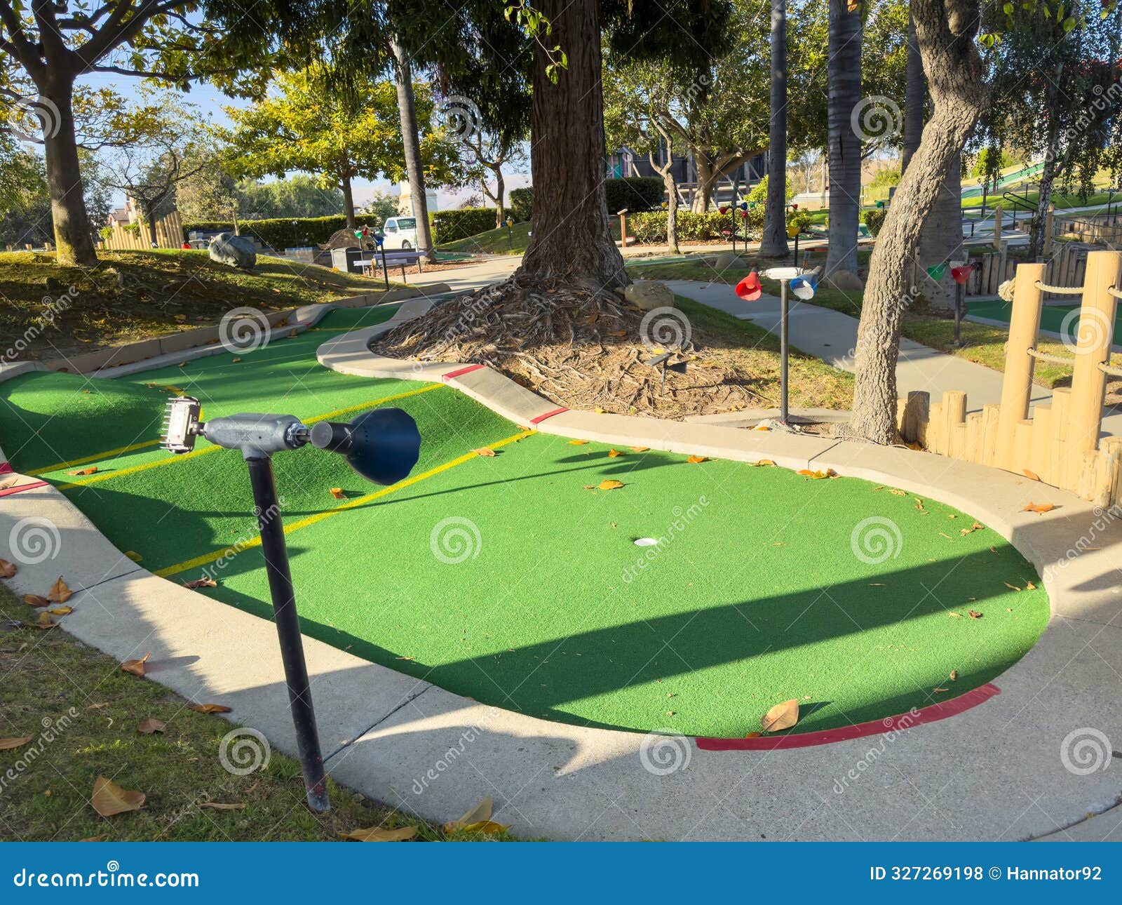 Mini-golf Course with Multiple Holes and Obstacles Surrounded by ...