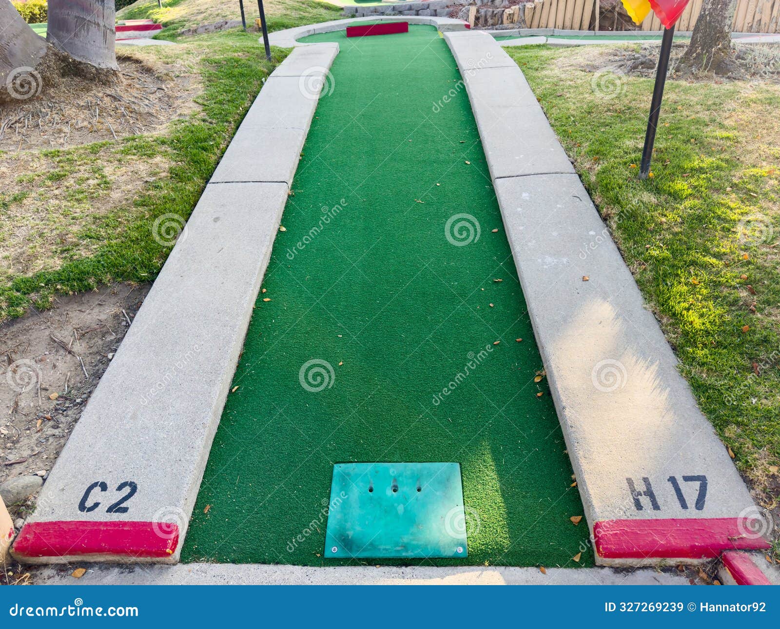 Mini-golf Course with Multiple Holes and Obstacles Surrounded by ...