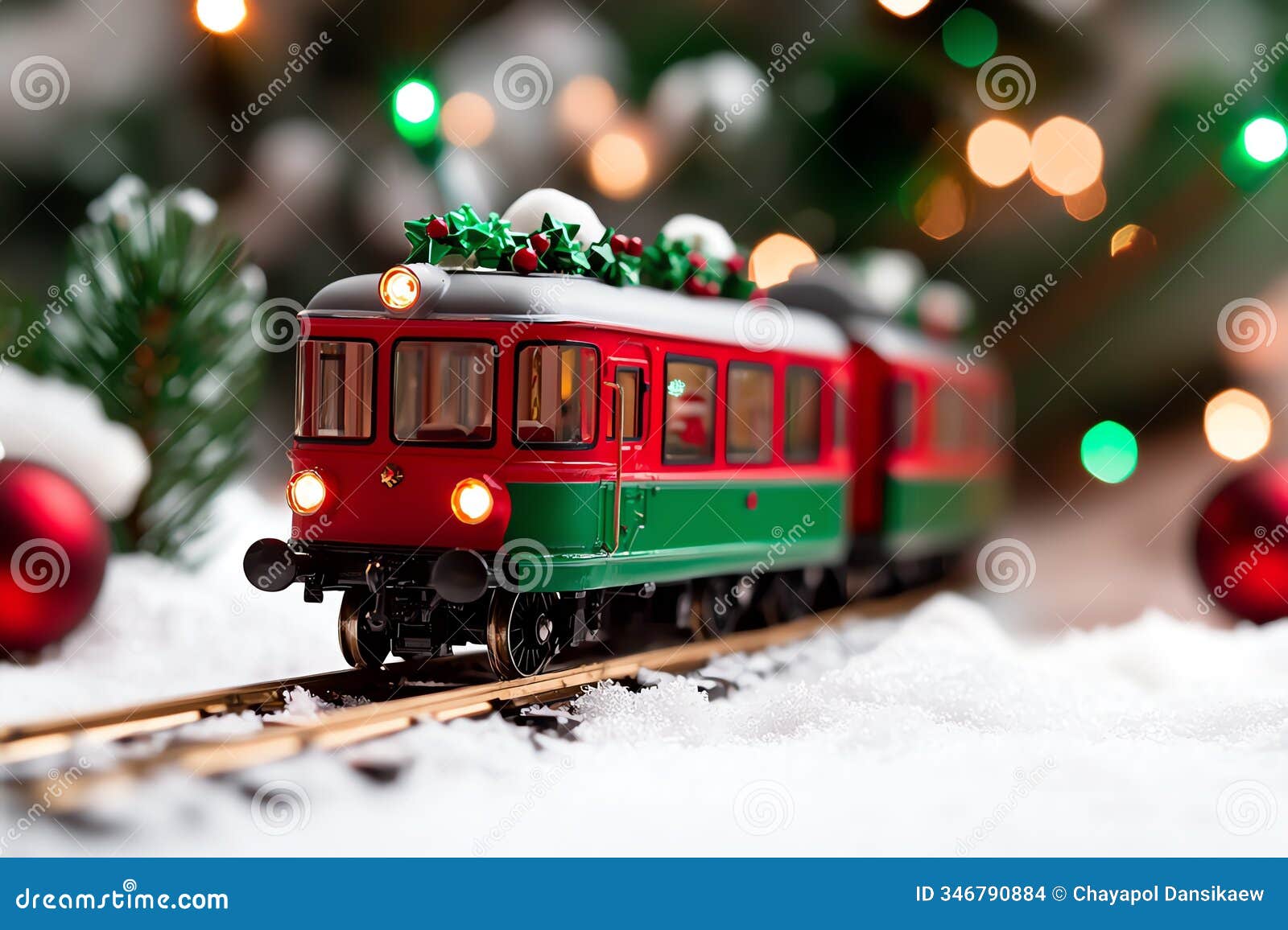 Colorful Model Train Decorated with Festive Ornaments on a Snowy ...
