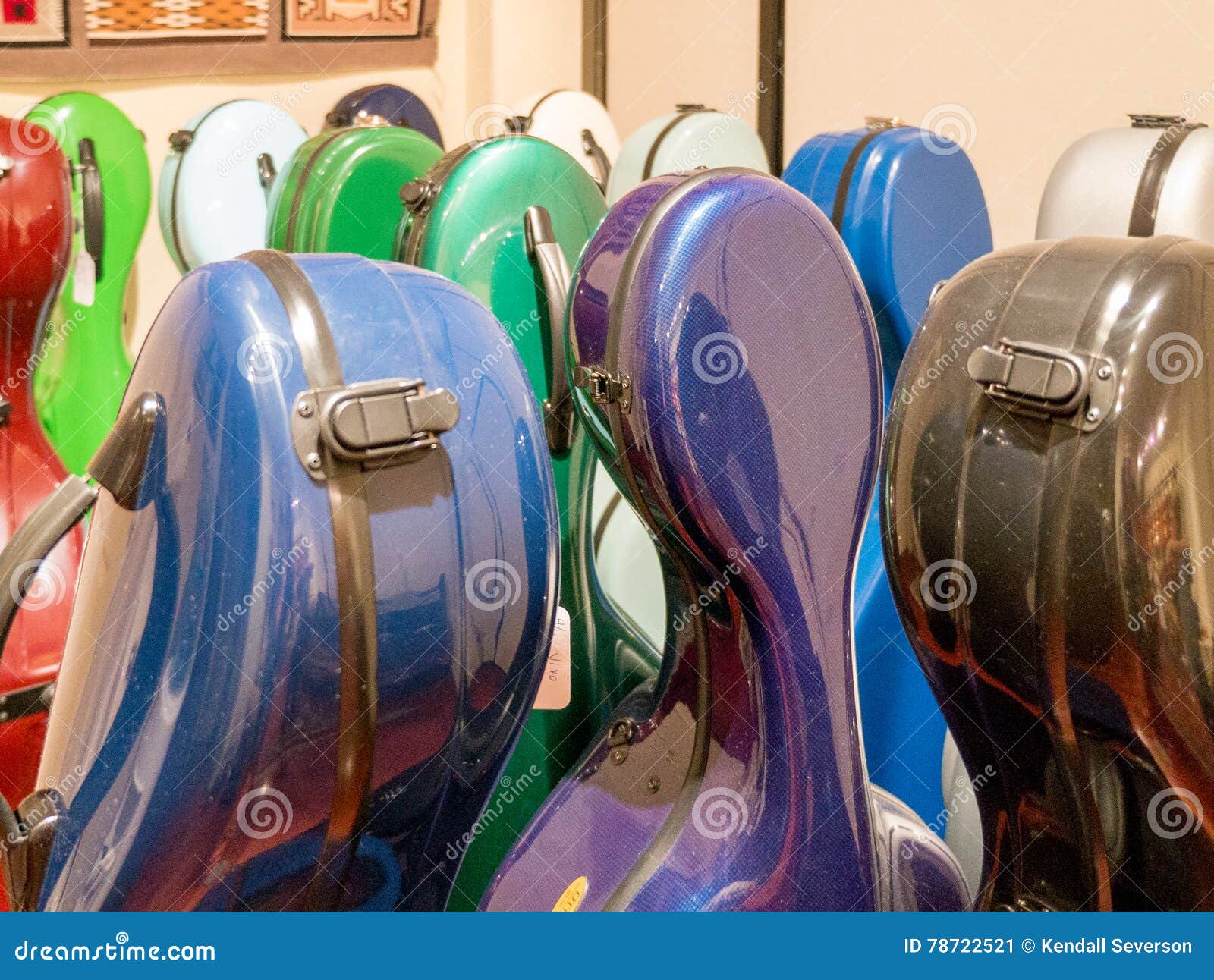 Colorful Multicolor Cello Carrying Cases Standing on Display Stock ...