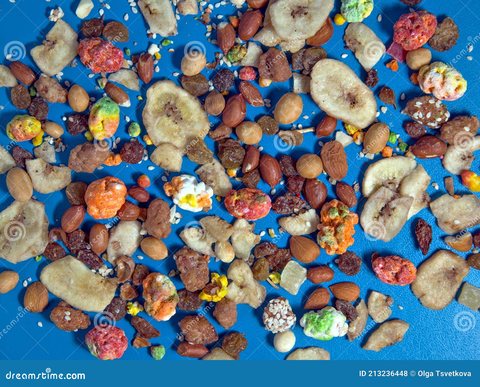 Colorful Nuts are Scattered on Blue Surface of Table Stock Photo ...