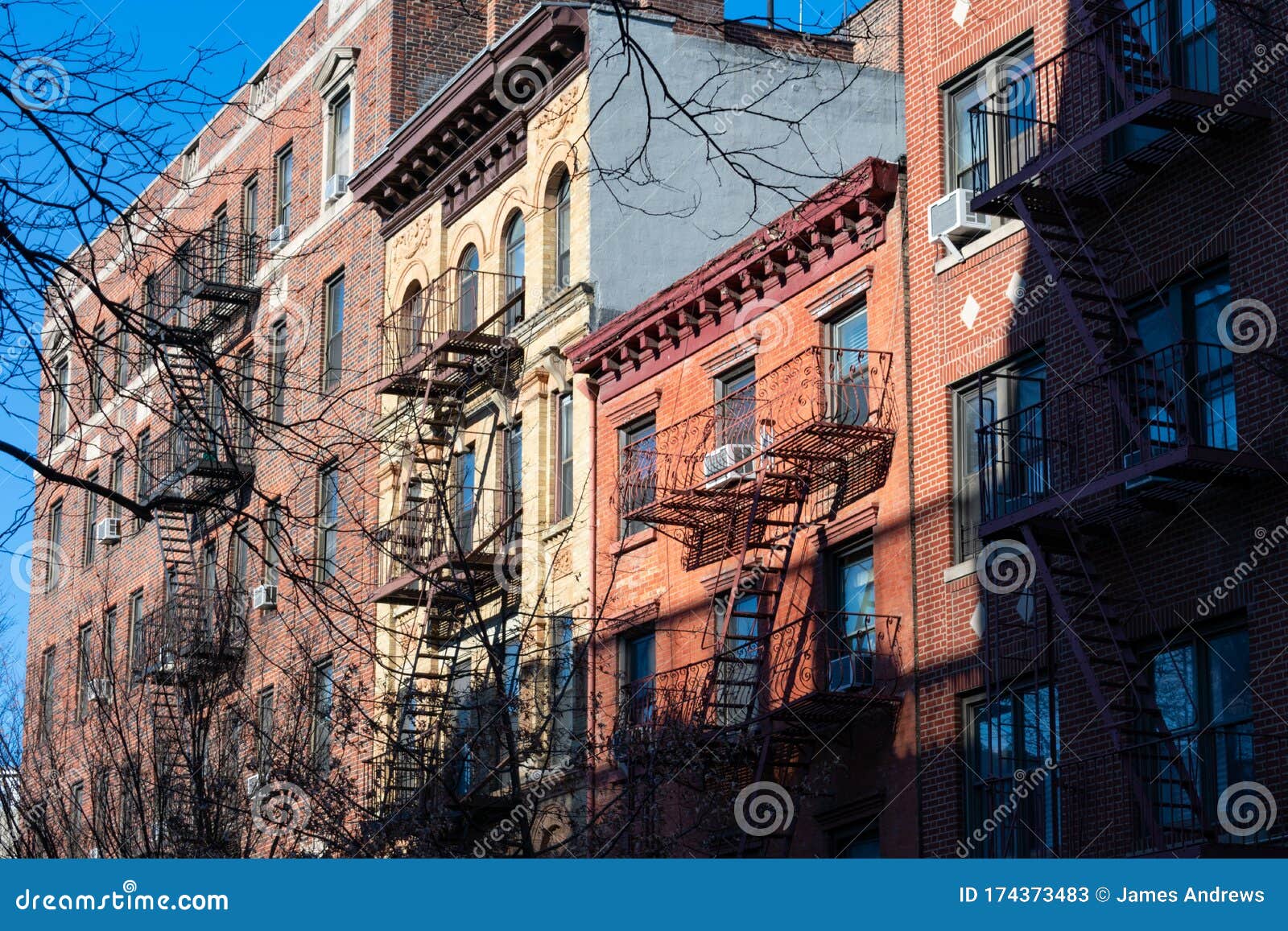 Colorful Old Buildings In Greenwich Village New York With Fire Escapes