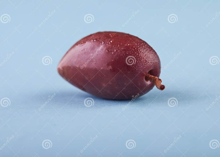 Colorful Olive on a Blue Background, Side View Stock Photo - Image of ...