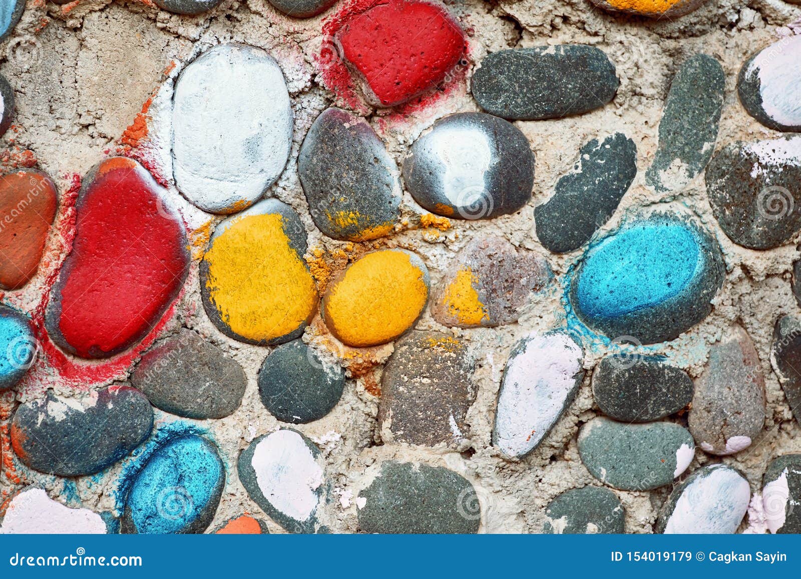 Colorful Painted Cobble Stones on the Textured Surface of a Pebble ...