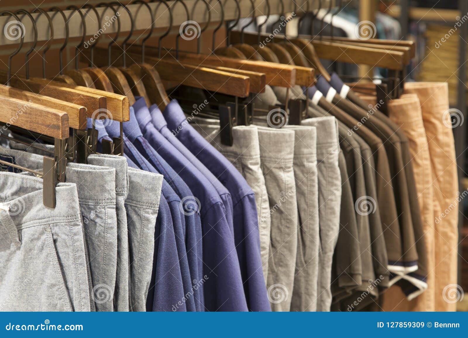 Pants Hanging Displaying on a Rack in Store Stock Image - Image of ...