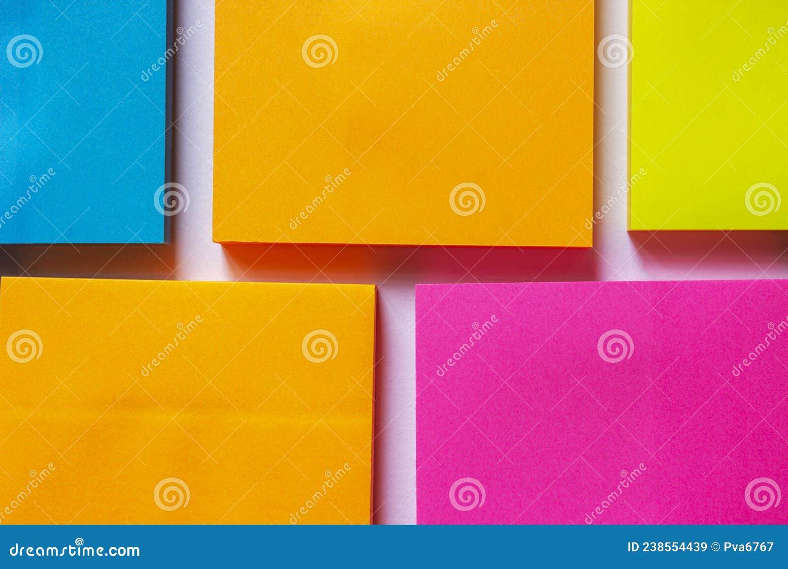 Colorful Paper Notes Stacked Together and Pinned on the Wall. Different ...