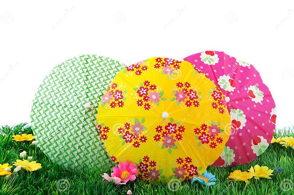 Colorful Parasols in the Grass Stock Image - Image of green, traveling ...