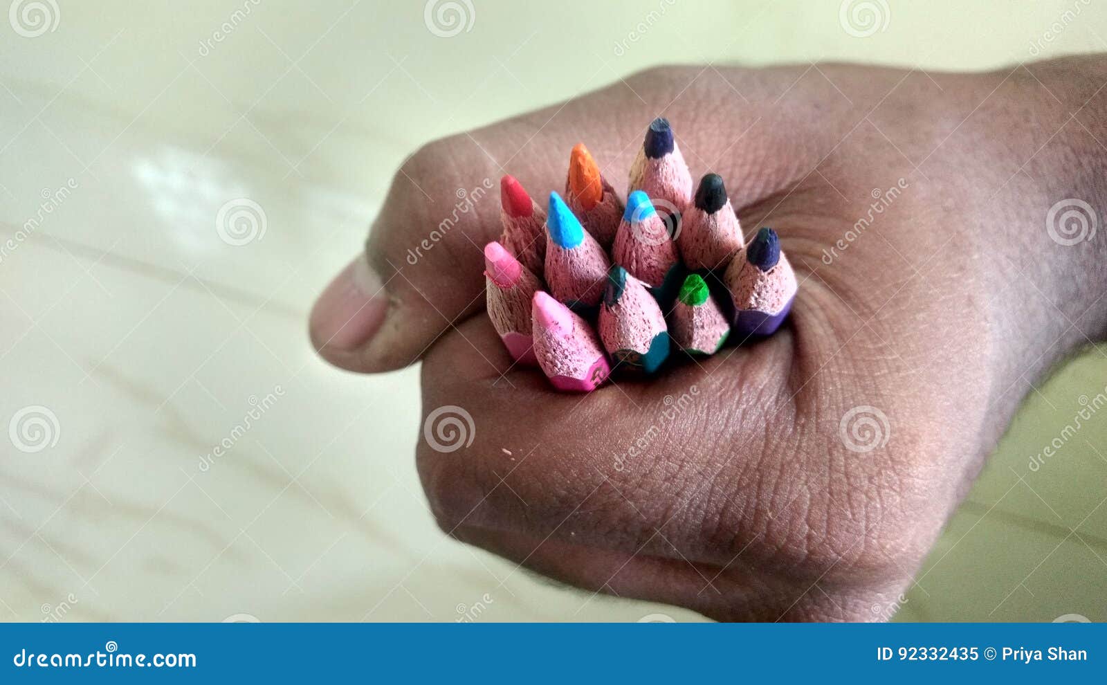 Colorful pencils in hand editorial image. Image of hand - 92332435