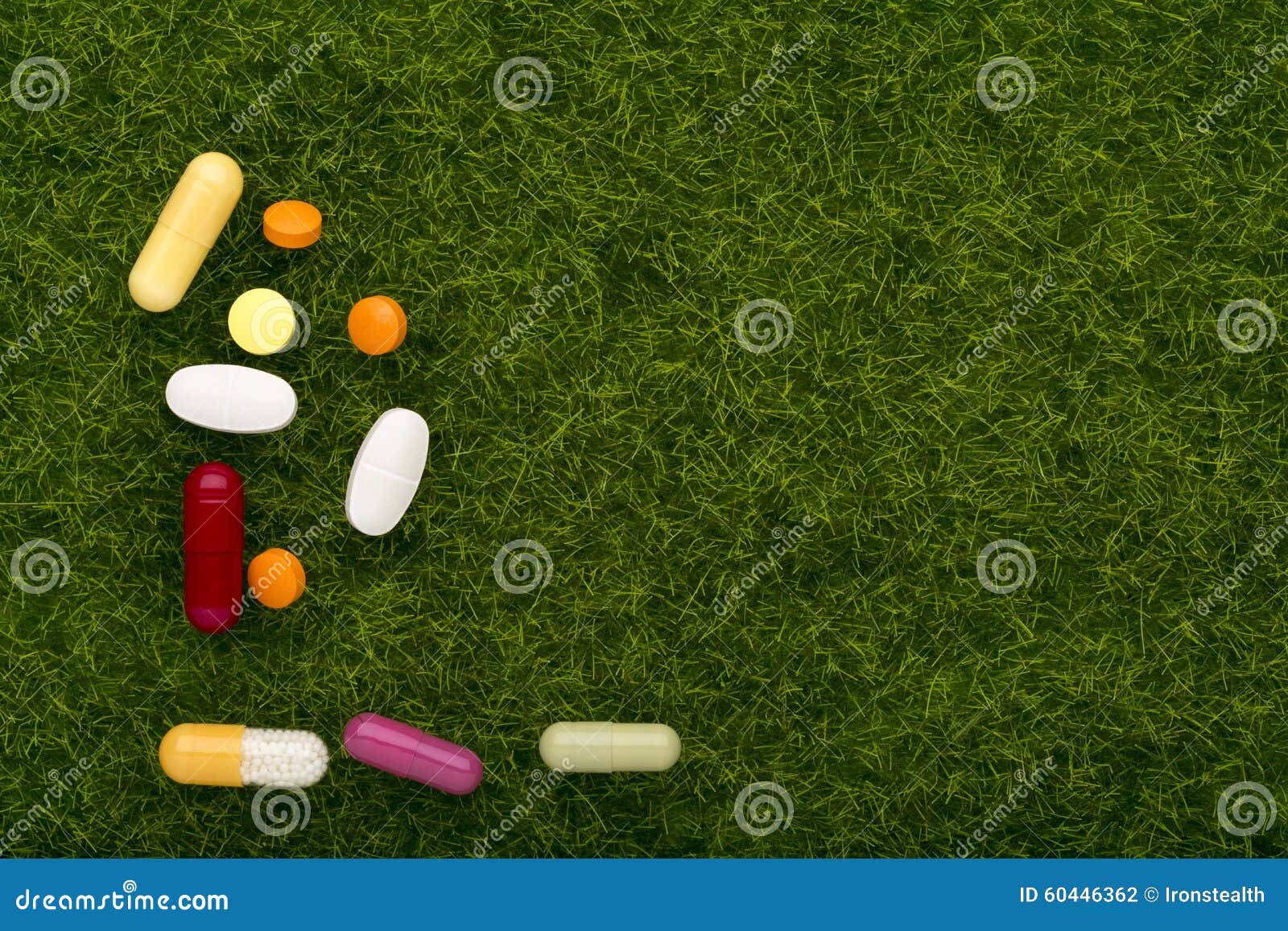 Colorful Pills on an Grass Background Stock Photo - Image of pink ...