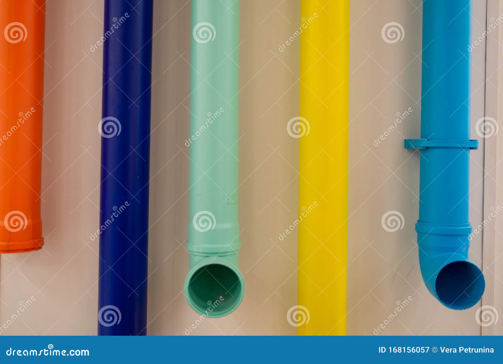 Colorful pipes on the wall stock image. Image of tube - 168156057