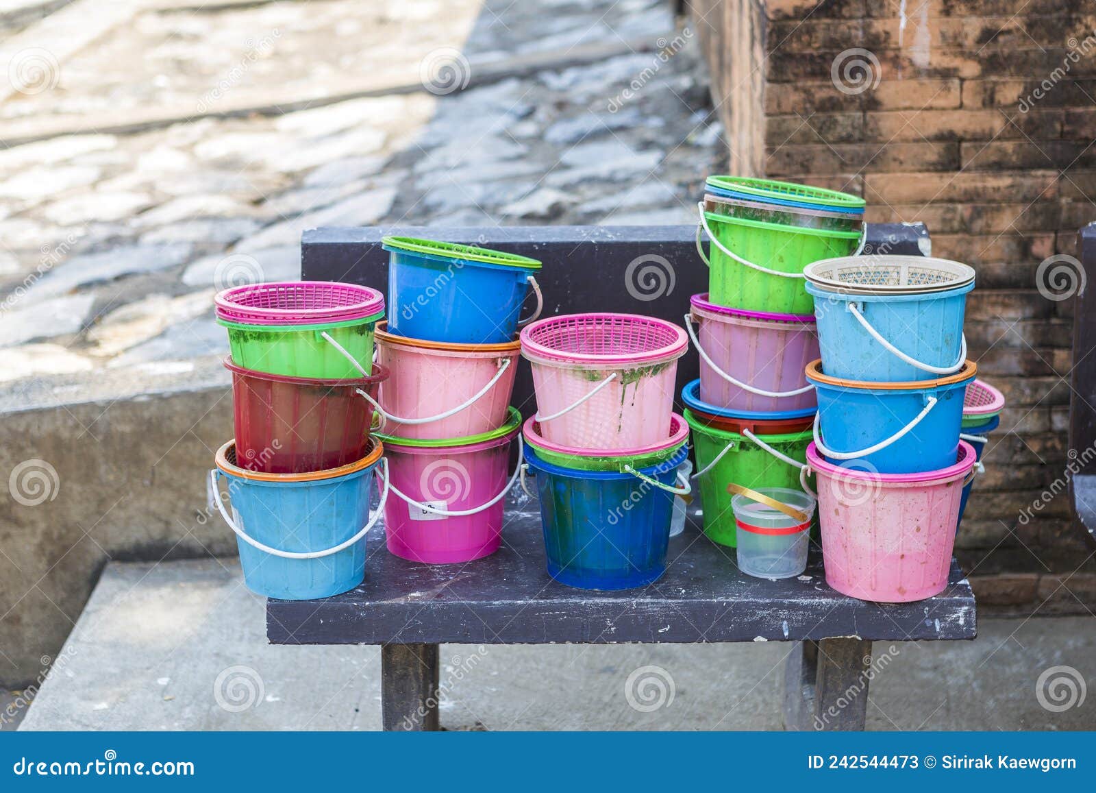 Colorful Plastic Bucket and Basket Stack, Dirty Plastic Container Stock ...