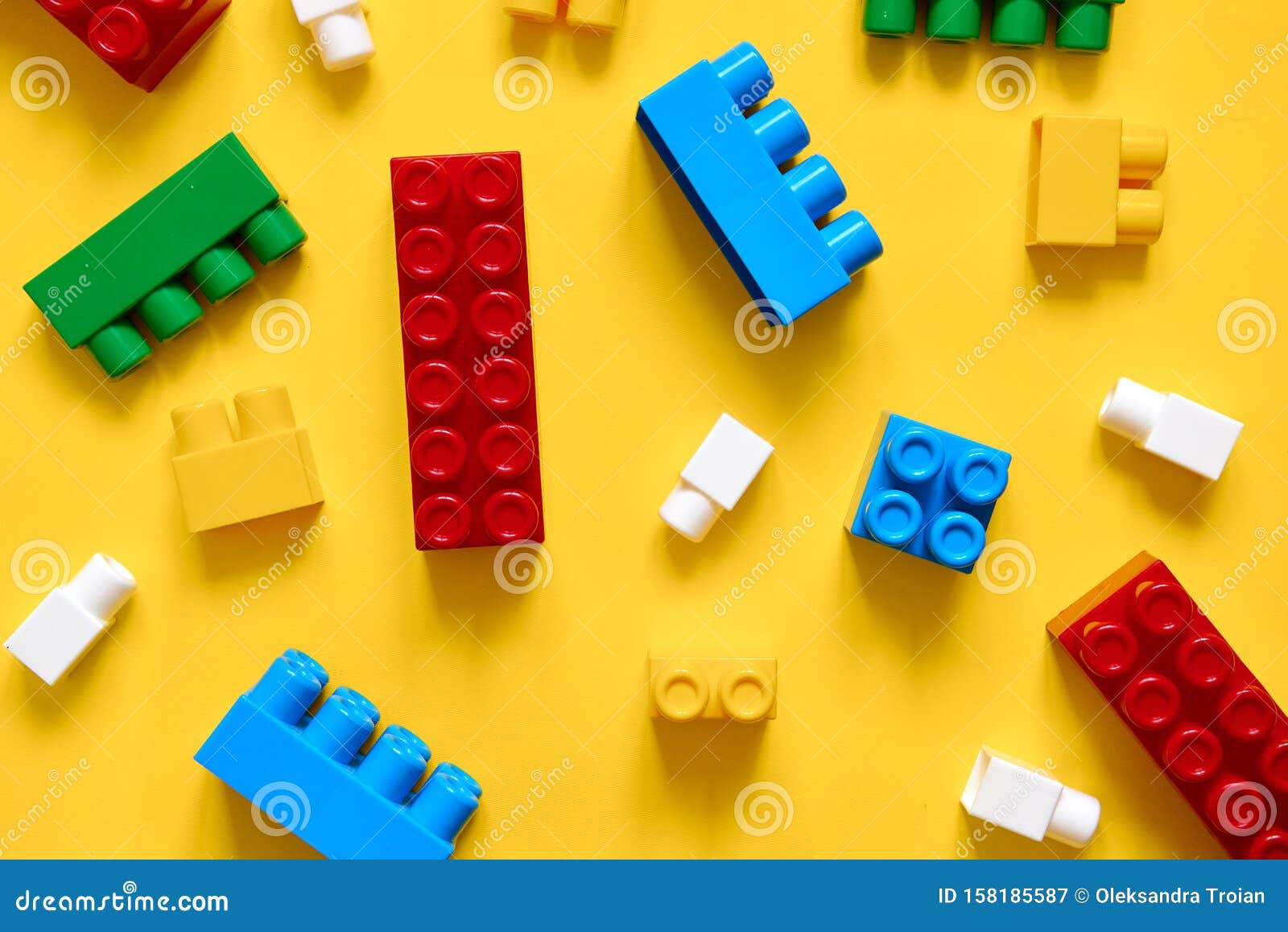 Colorful Plastic Building Blocks Flat Lay. Yellow Background. Child ...