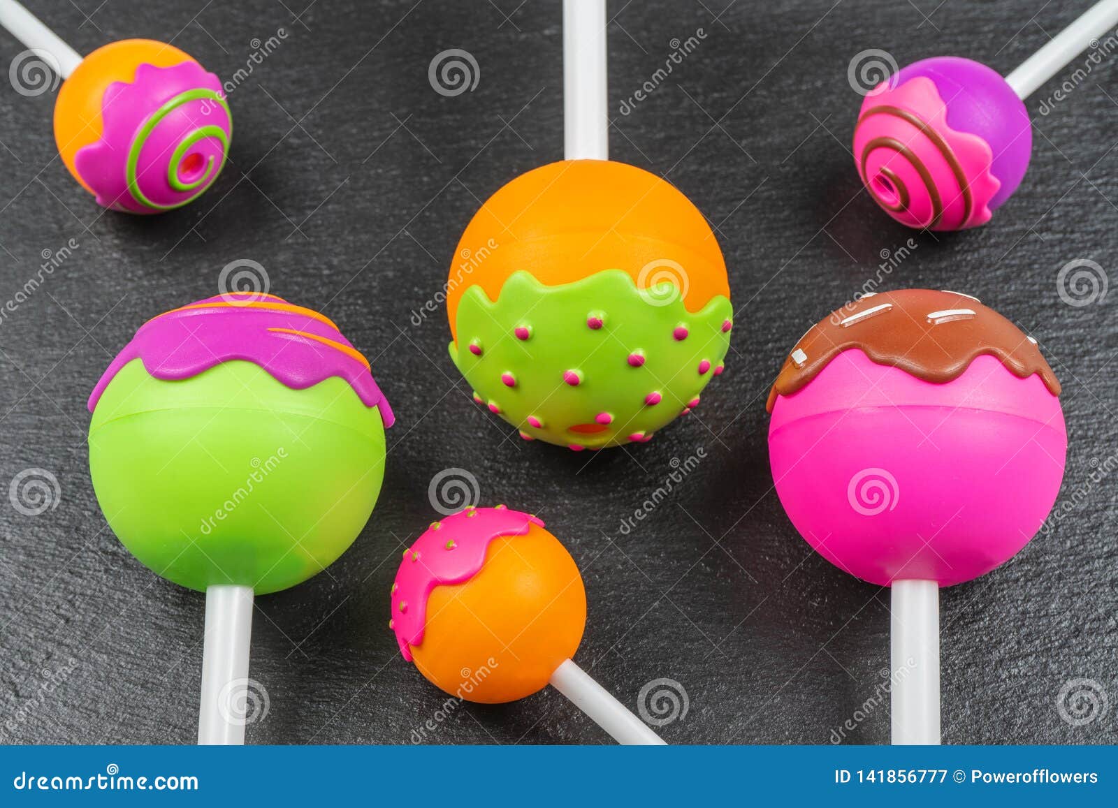 Colorful Plastic Candies and Lollipops Over Stone Background Stock ...