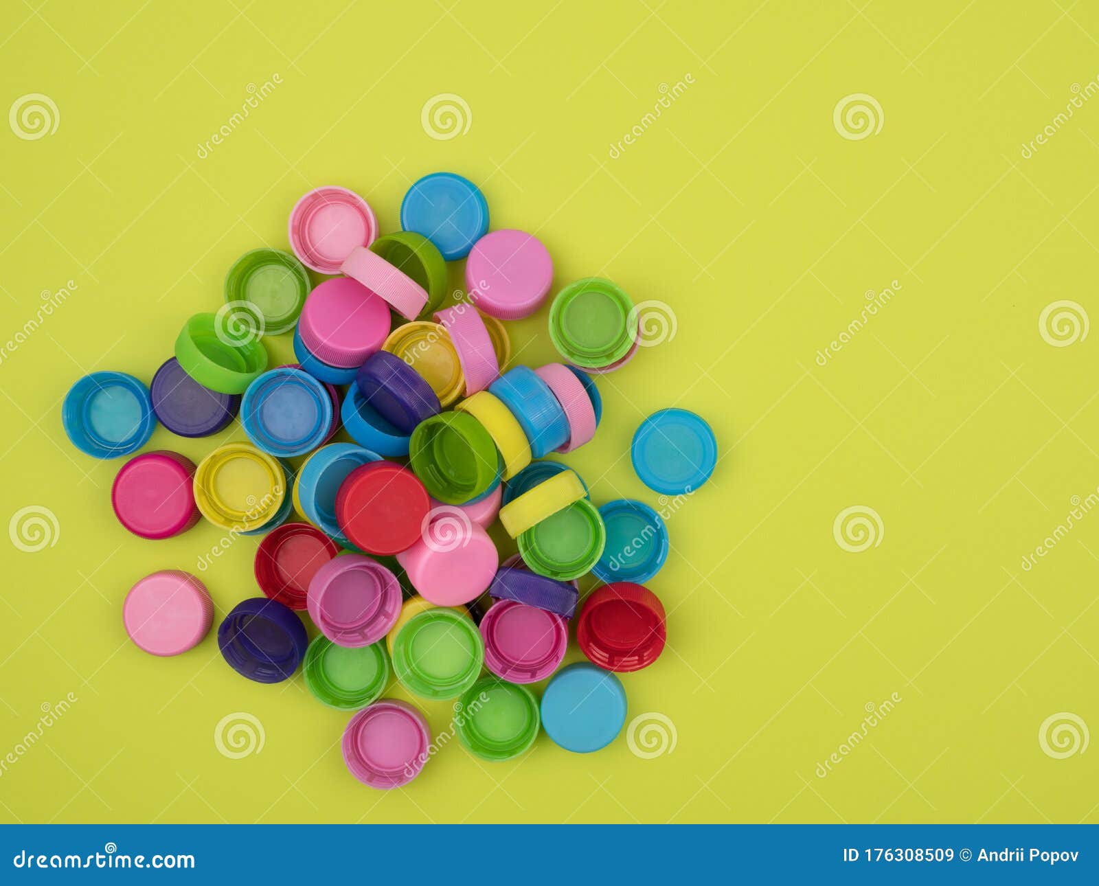 Colorful Plastic Caps for Bottles on a Bright Green Background Stock ...