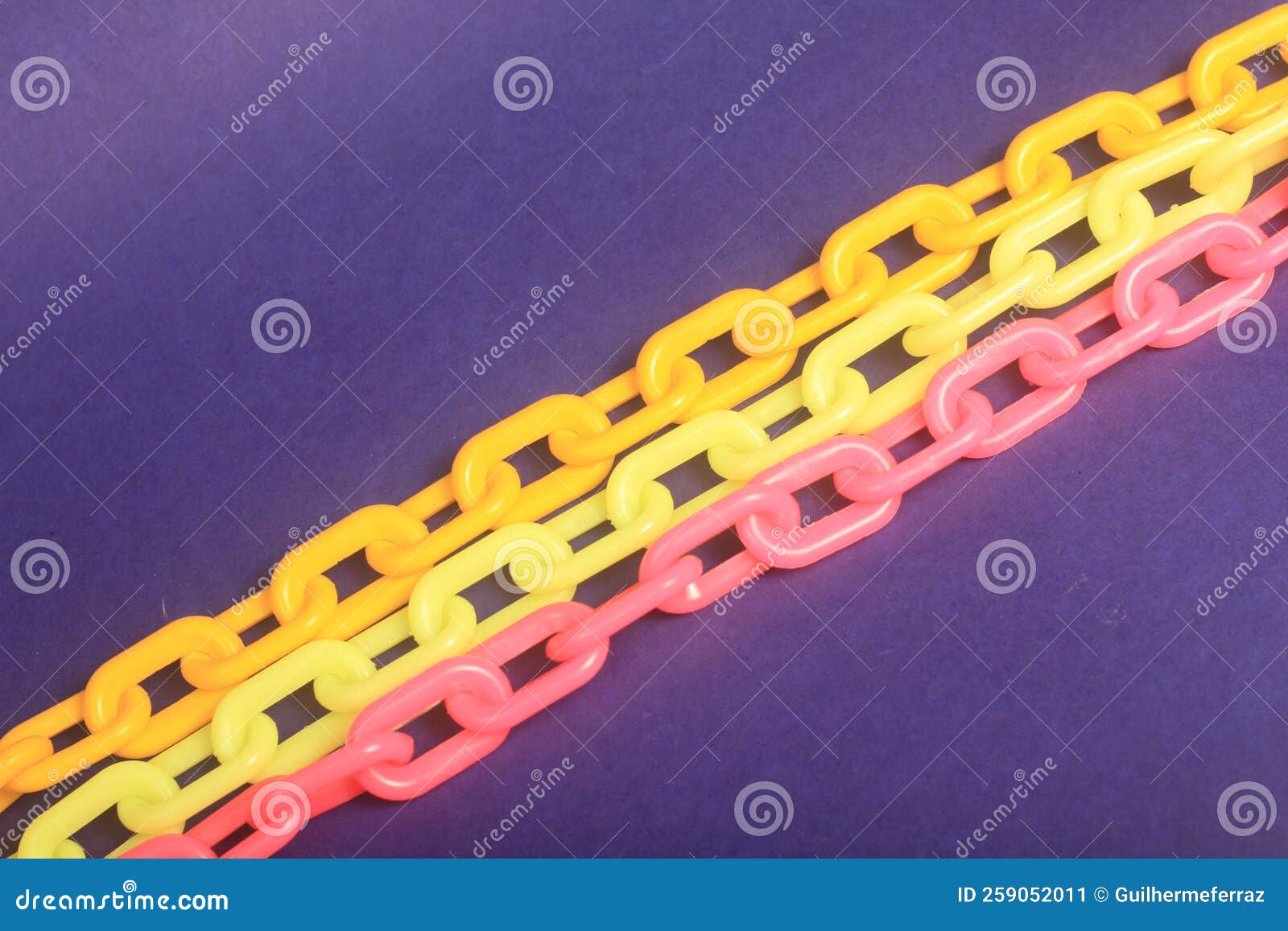 Colorful Plastic Chains on a Blue Background Stock Image - Image of ...
