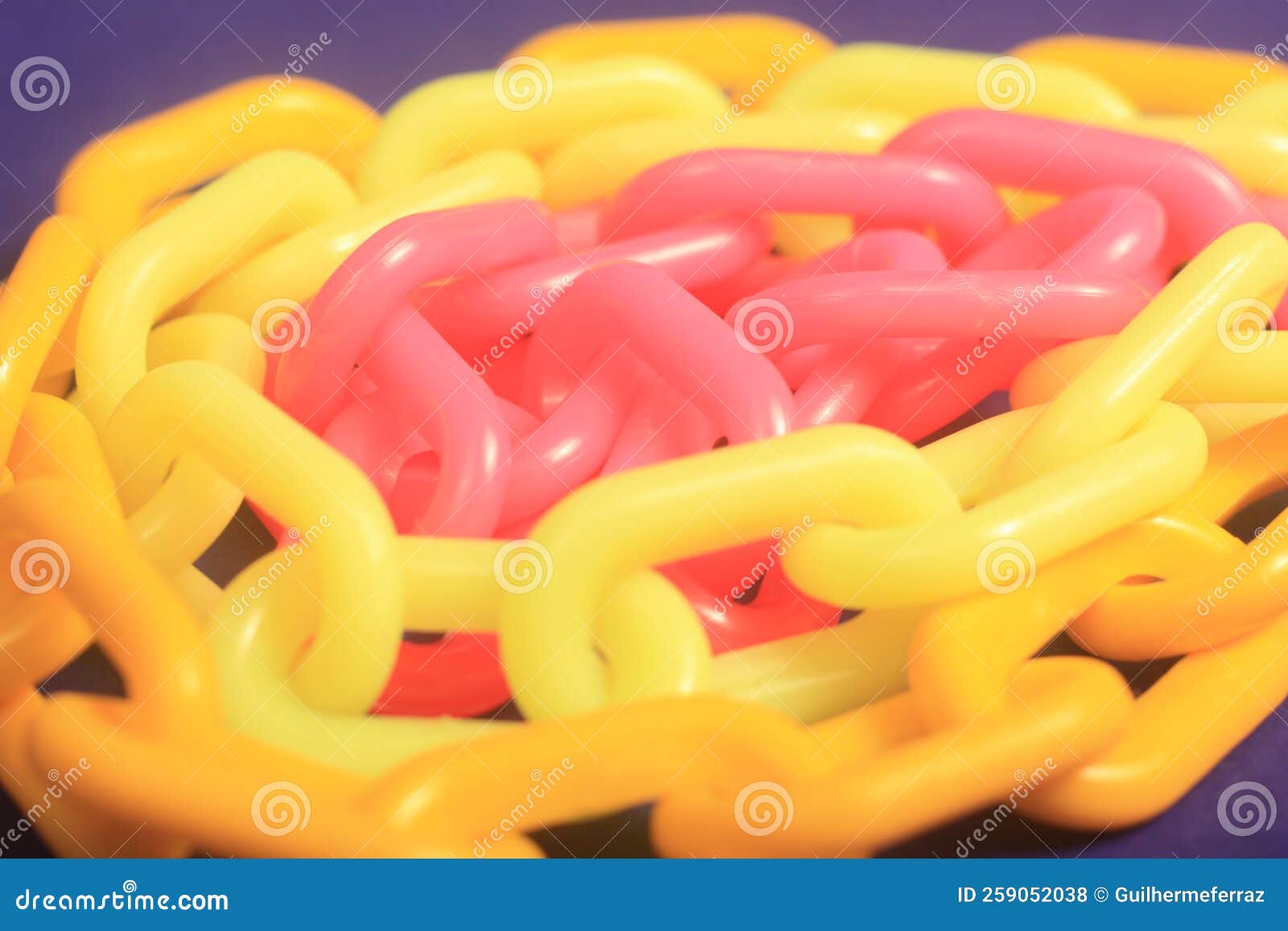 Colorful Plastic Chains on a Blue Background Stock Photo - Image of ...
