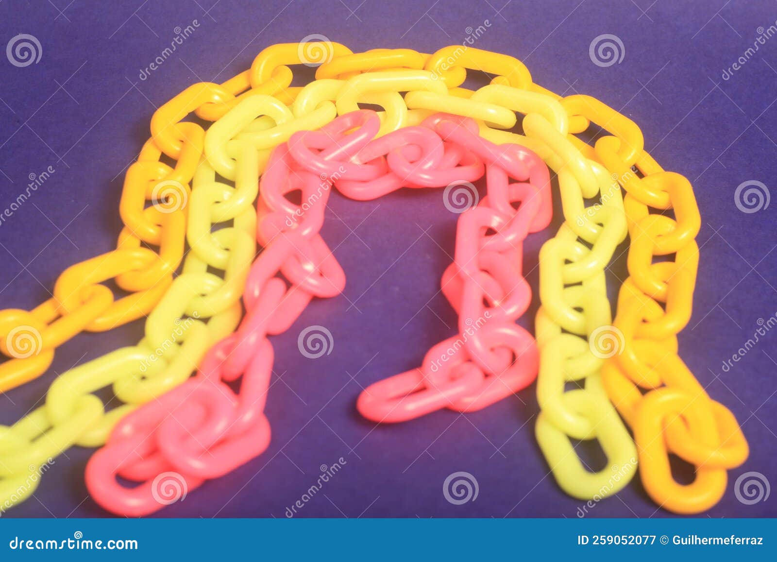 Colorful Plastic Chains on a Blue Background Stock Image - Image of ...