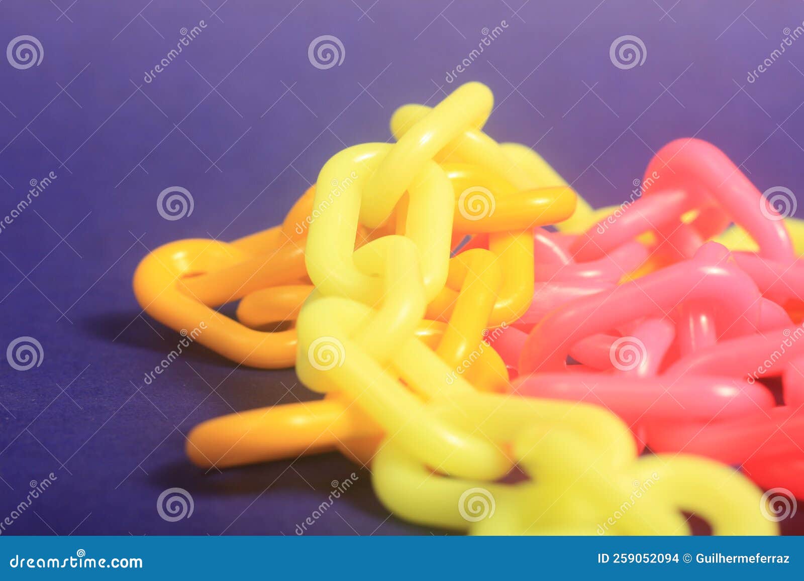 Colorful Plastic Chains on a Blue Background Stock Photo - Image of ...
