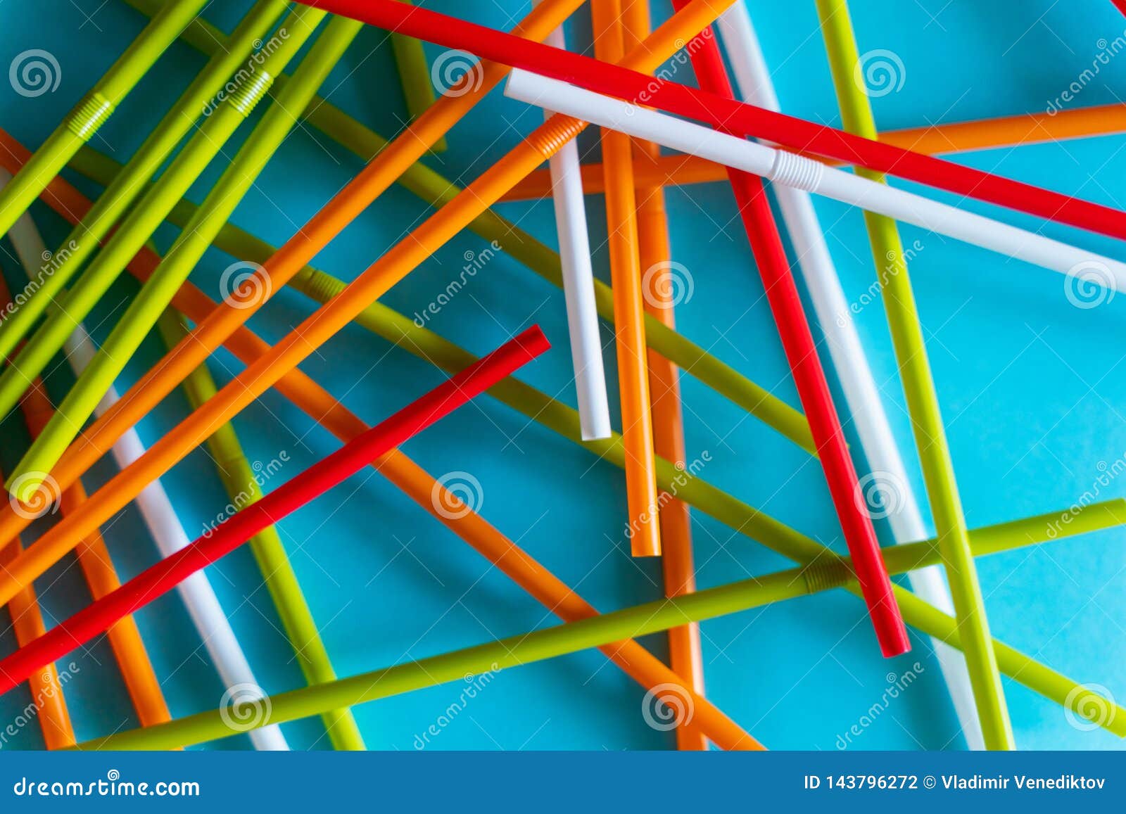 Colorful Plastic Cocktail Tubes Over Blue Background. Abstract Colorful ...