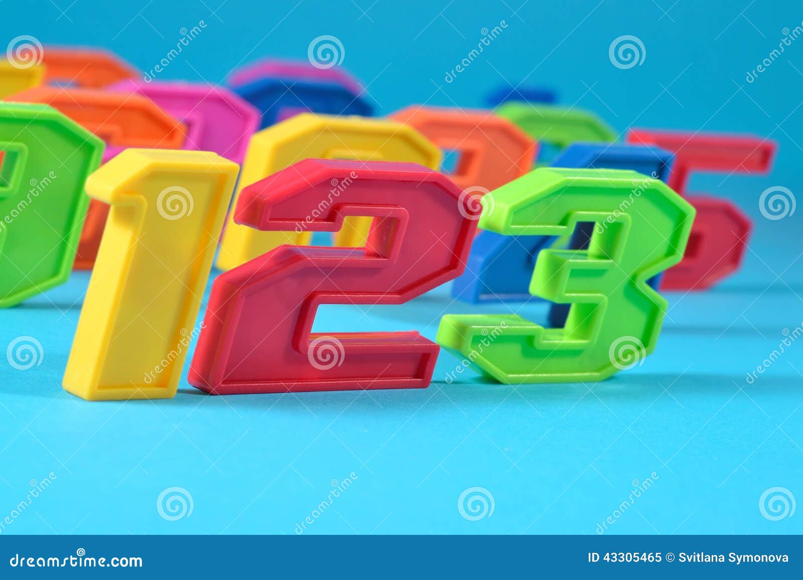 Colorful Plastic Numbers 123 on a Blue Background Stock Image - Image ...