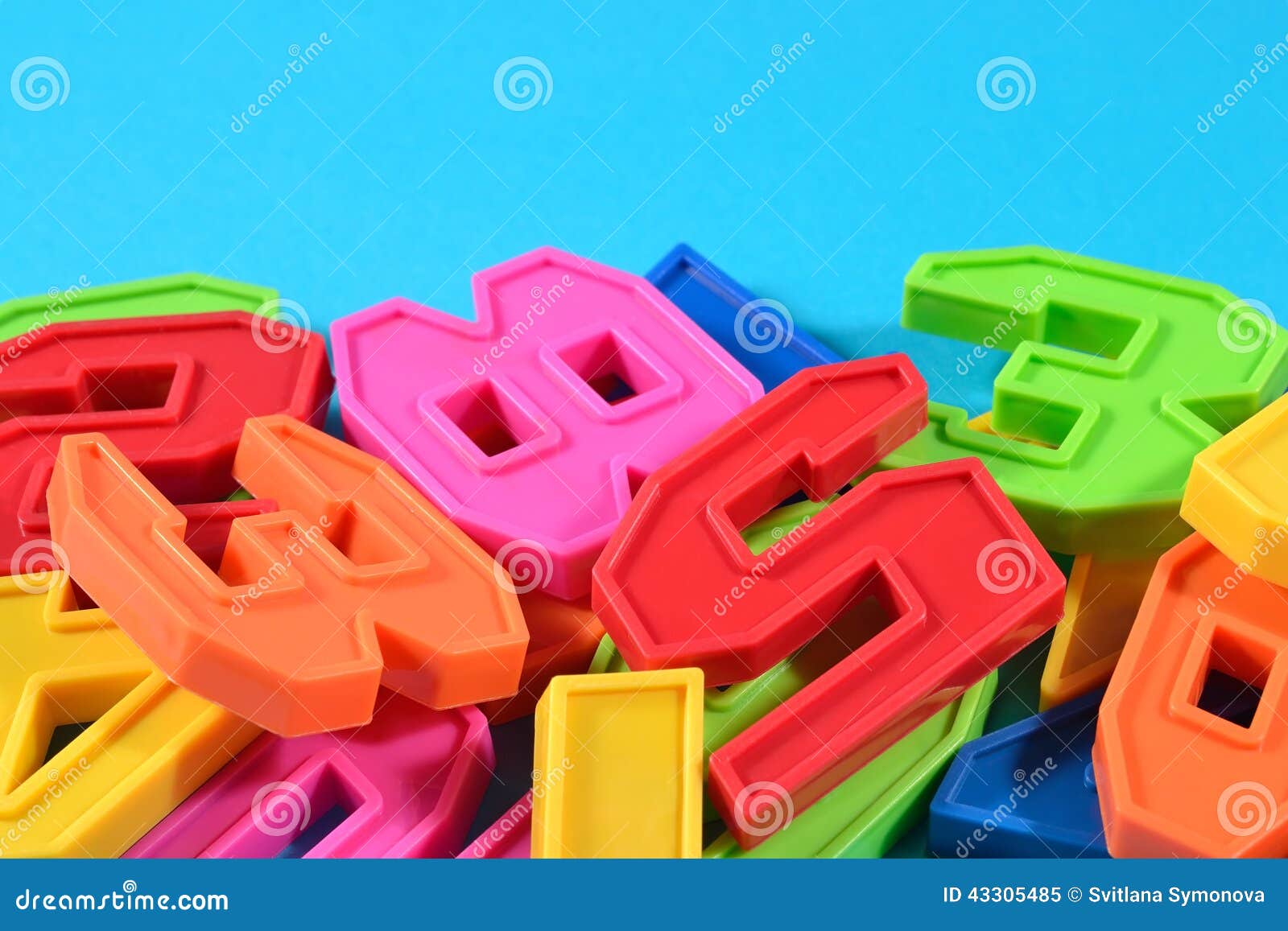 Colorful Plastic Numbers on a Blue Background Stock Image - Image of ...