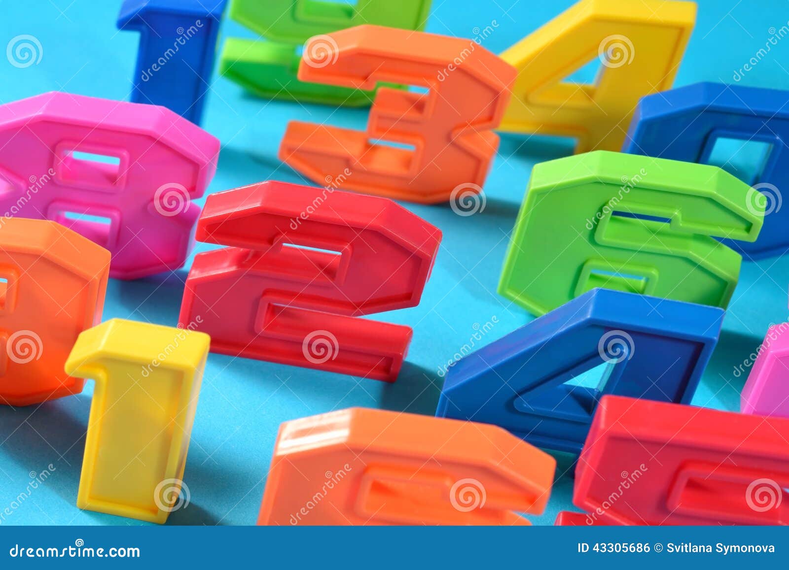 Colorful Plastic Numbers on a Blue Background Stock Photo - Image of ...