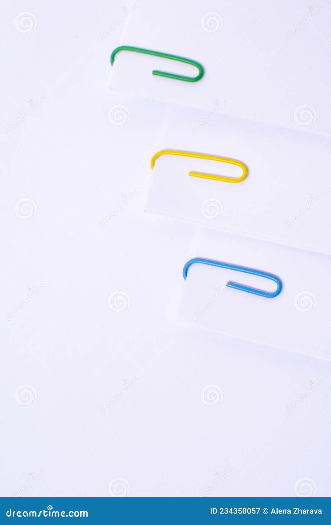 Colorful Plastic Paper Clips Attached To a Blank White Paper. Stock ...
