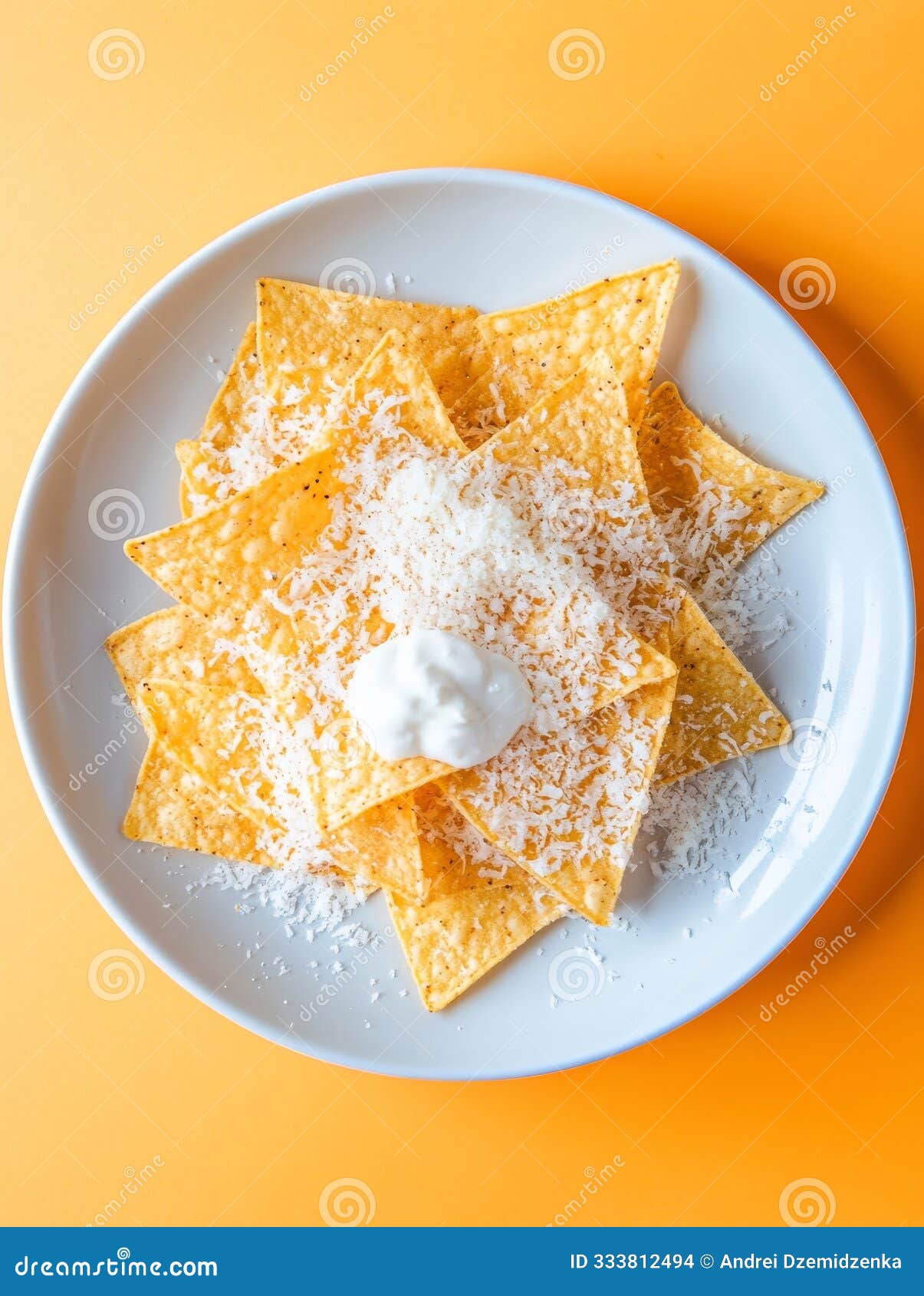 A Colorful Plate of Nachos with Melted Cheese and Dip. Stock Photo ...