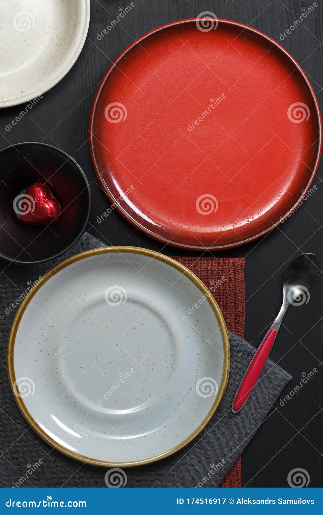 Colorful plates on table stock image. Image of setting - 174516917