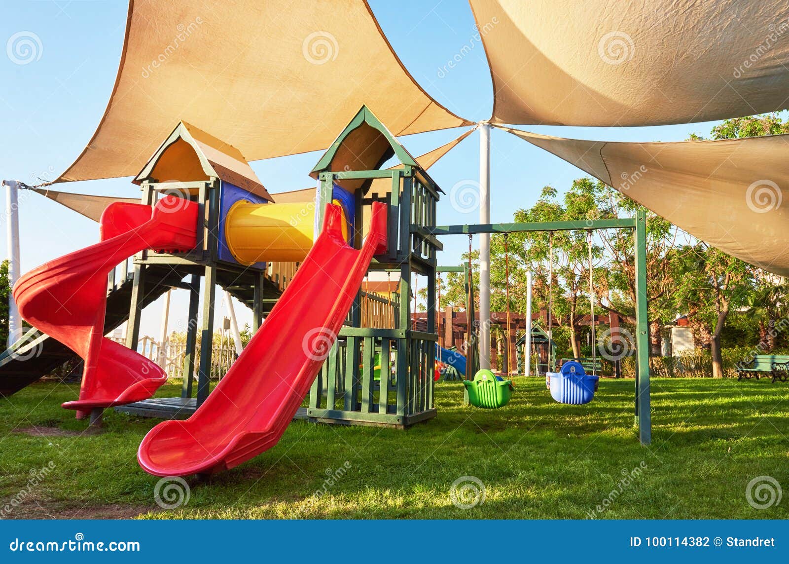 Colorful Playground in the Yard in the Park at Sunset. Stock Photo ...
